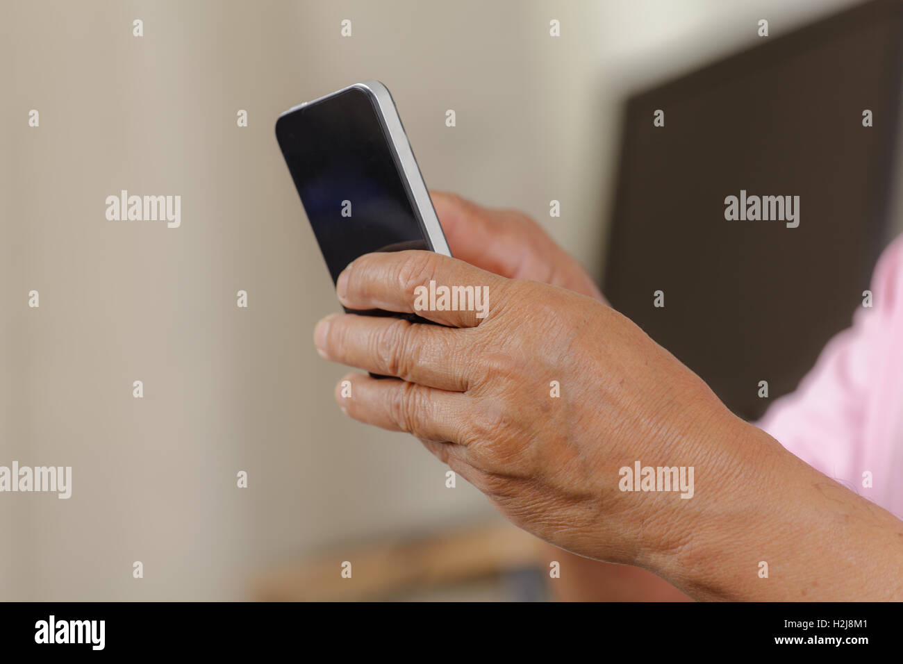 Senior man using phone Stock Photo - Alamy