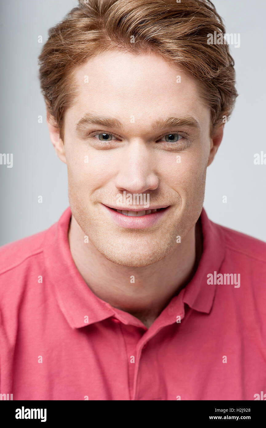 Smiling handsome guy isolated over white Stock Photo - Alamy