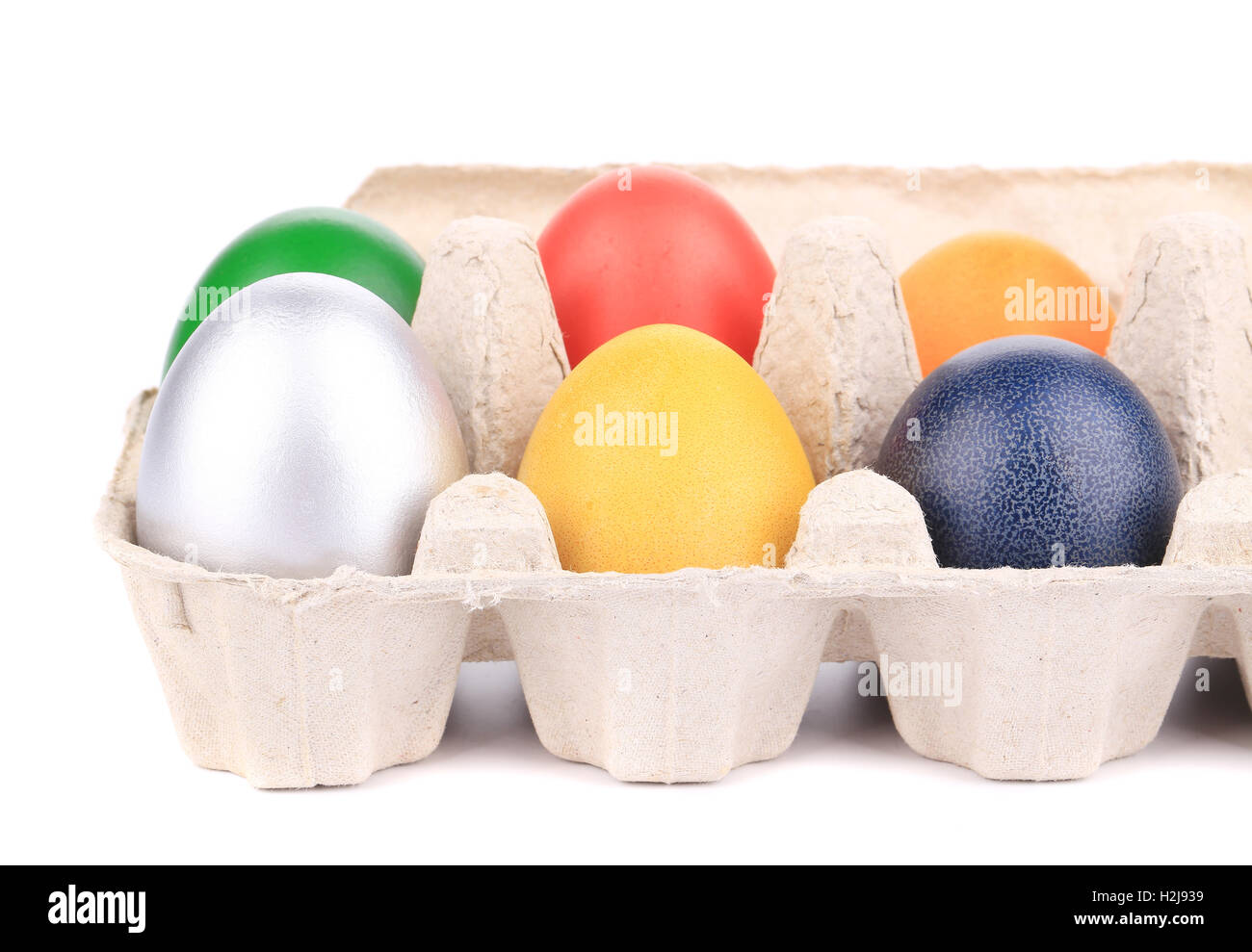 Cardboard egg box with Easter colored eggs Stock Photo - Alamy
