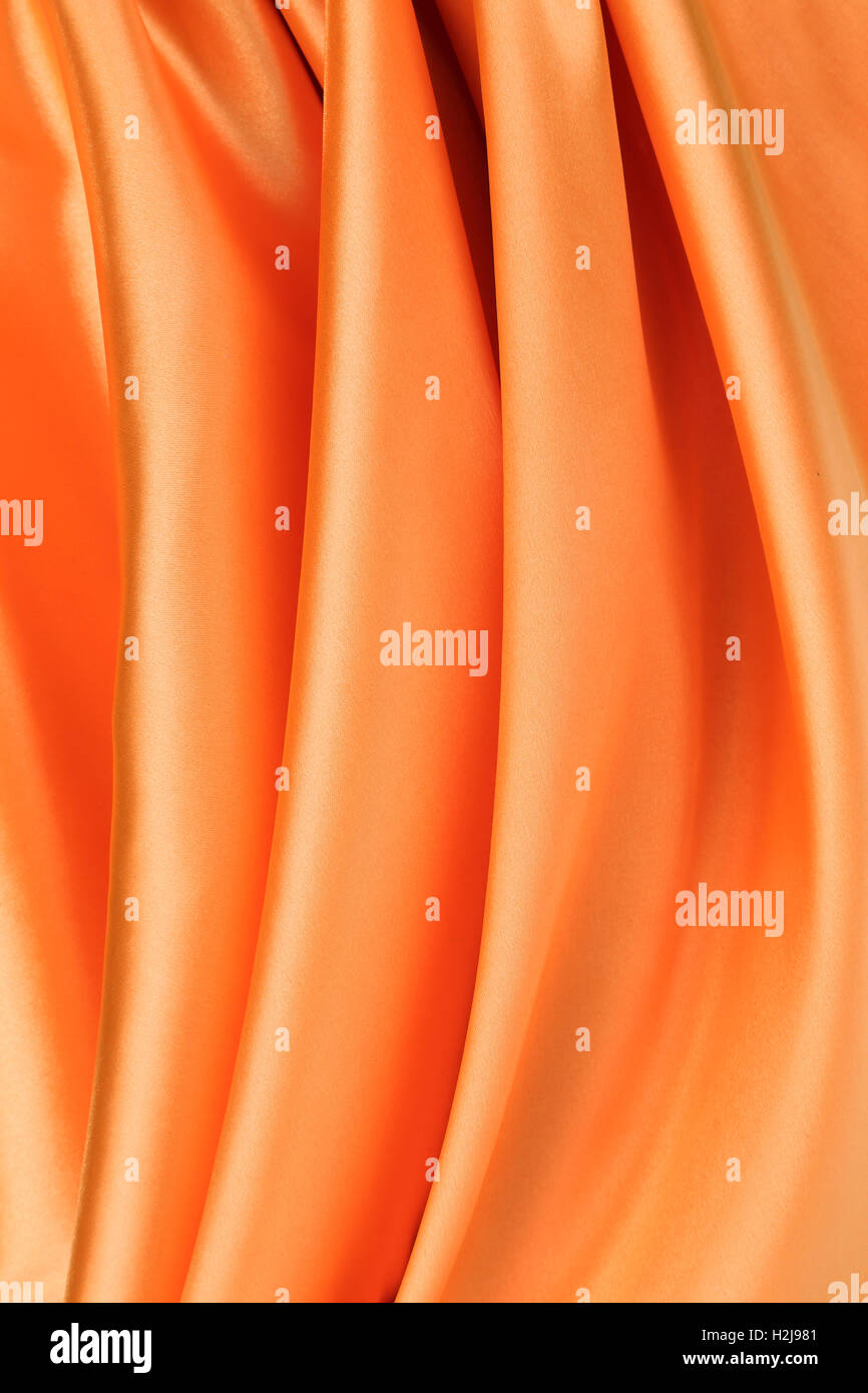 Folded orange silk Stock Photo - Alamy