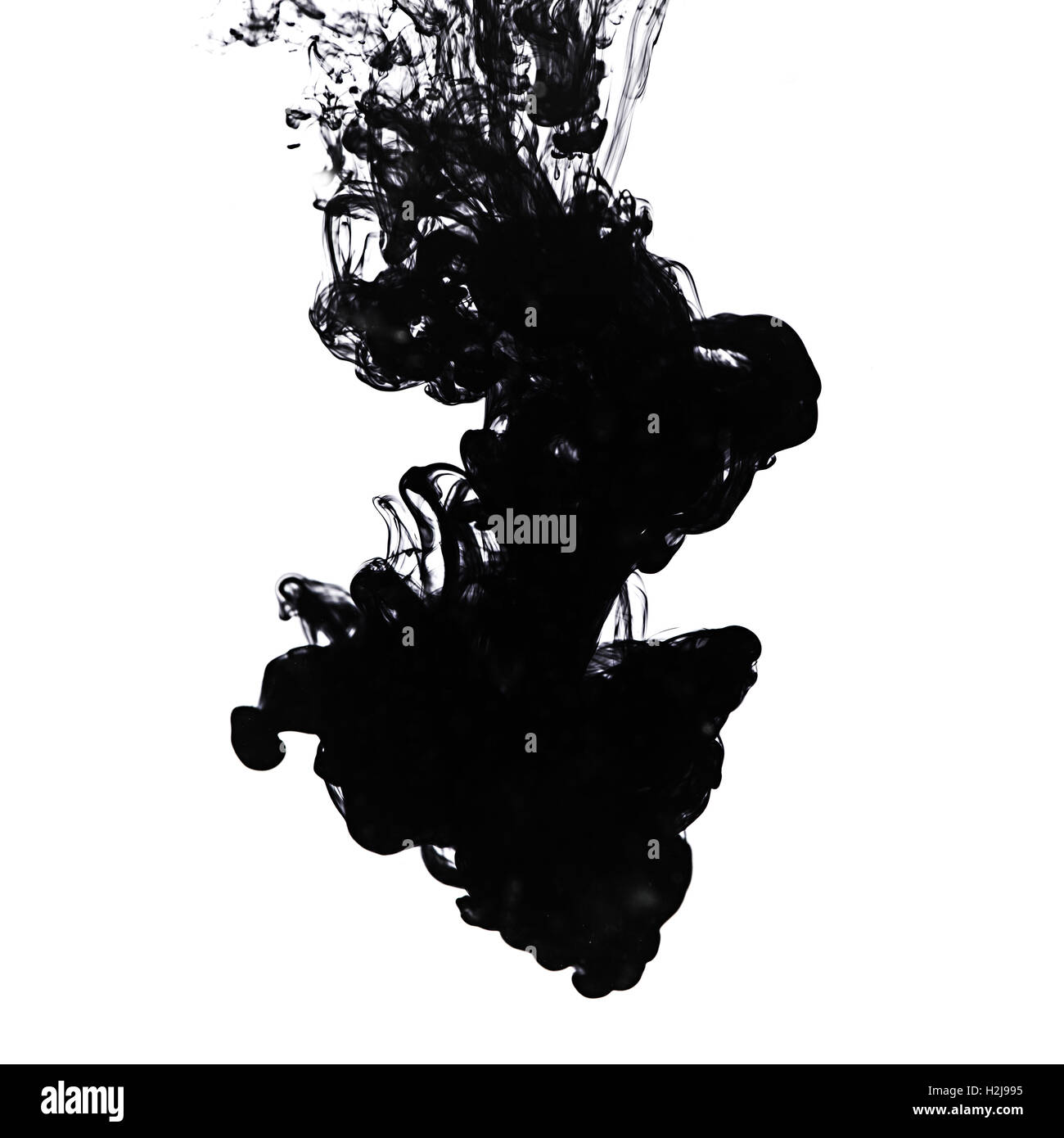 Ink in water on white background Stock Photo - Alamy