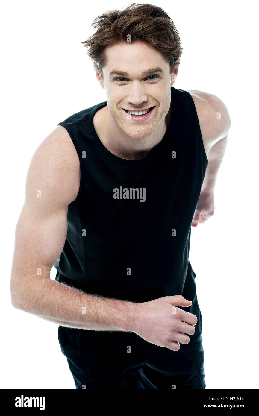 Smiling sportive man running Stock Photo - Alamy