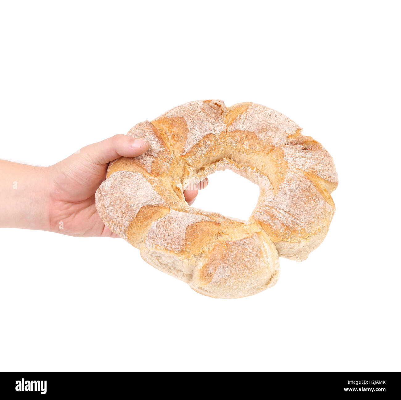 Hand holding round bread Stock Photo - Alamy