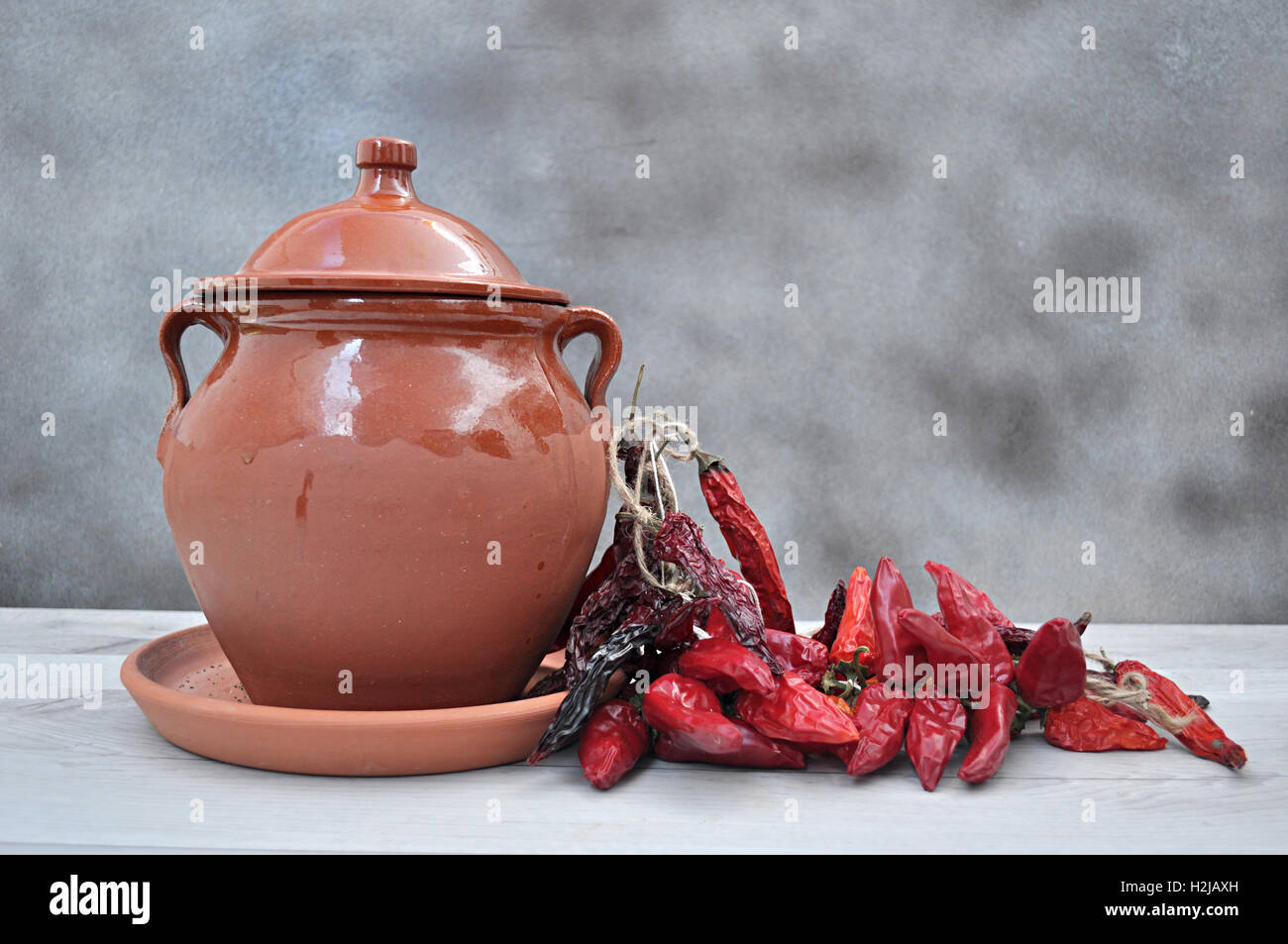 clay pot and dried peppers Stock Photo - Alamy