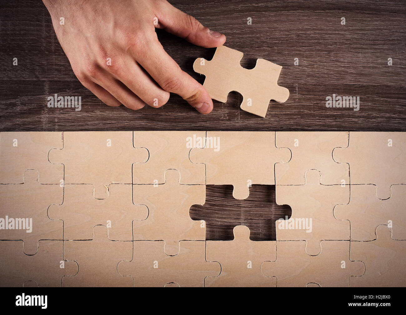 Complete a puzzle Stock Photo - Alamy