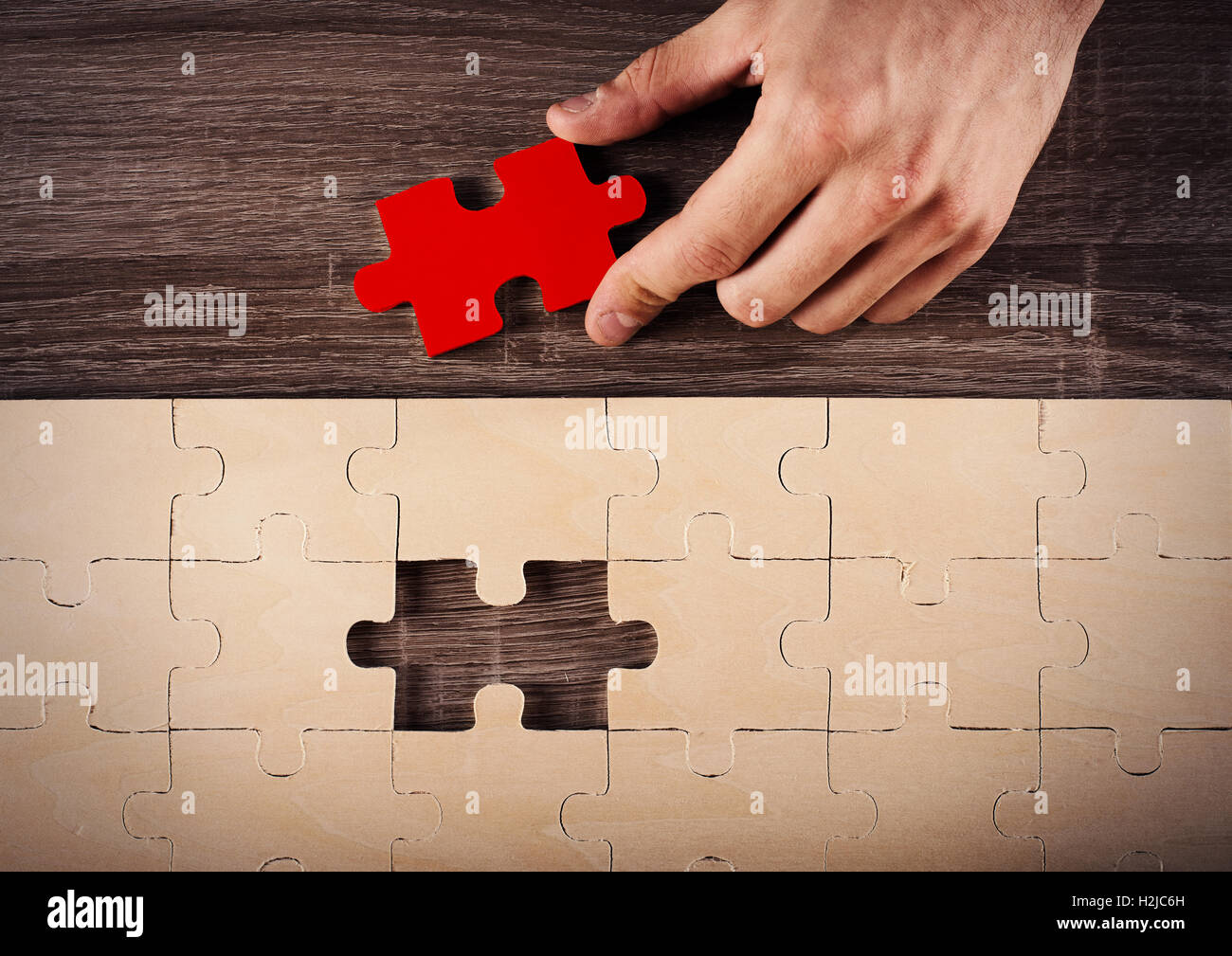 Complete a puzzle Stock Photo - Alamy