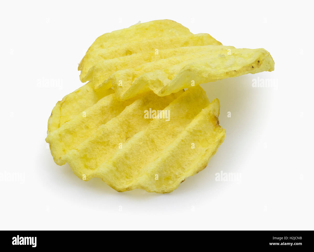 Ridge cut potato chips. Clipping path included in jpeg Stock Photo - Alamy