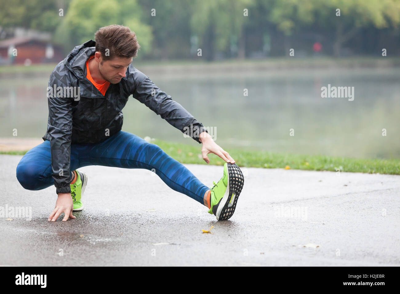 Athletic young man preparing for his morning running routine Stock ...