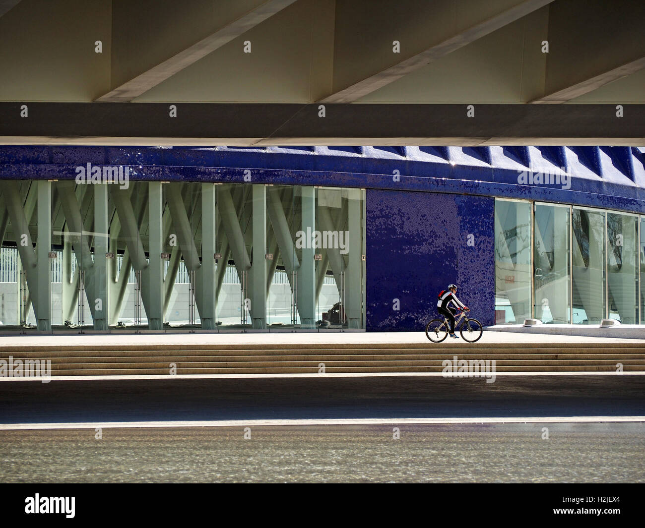 cyclist passing building at Arts & Sciences Centre Center Valencia with ...