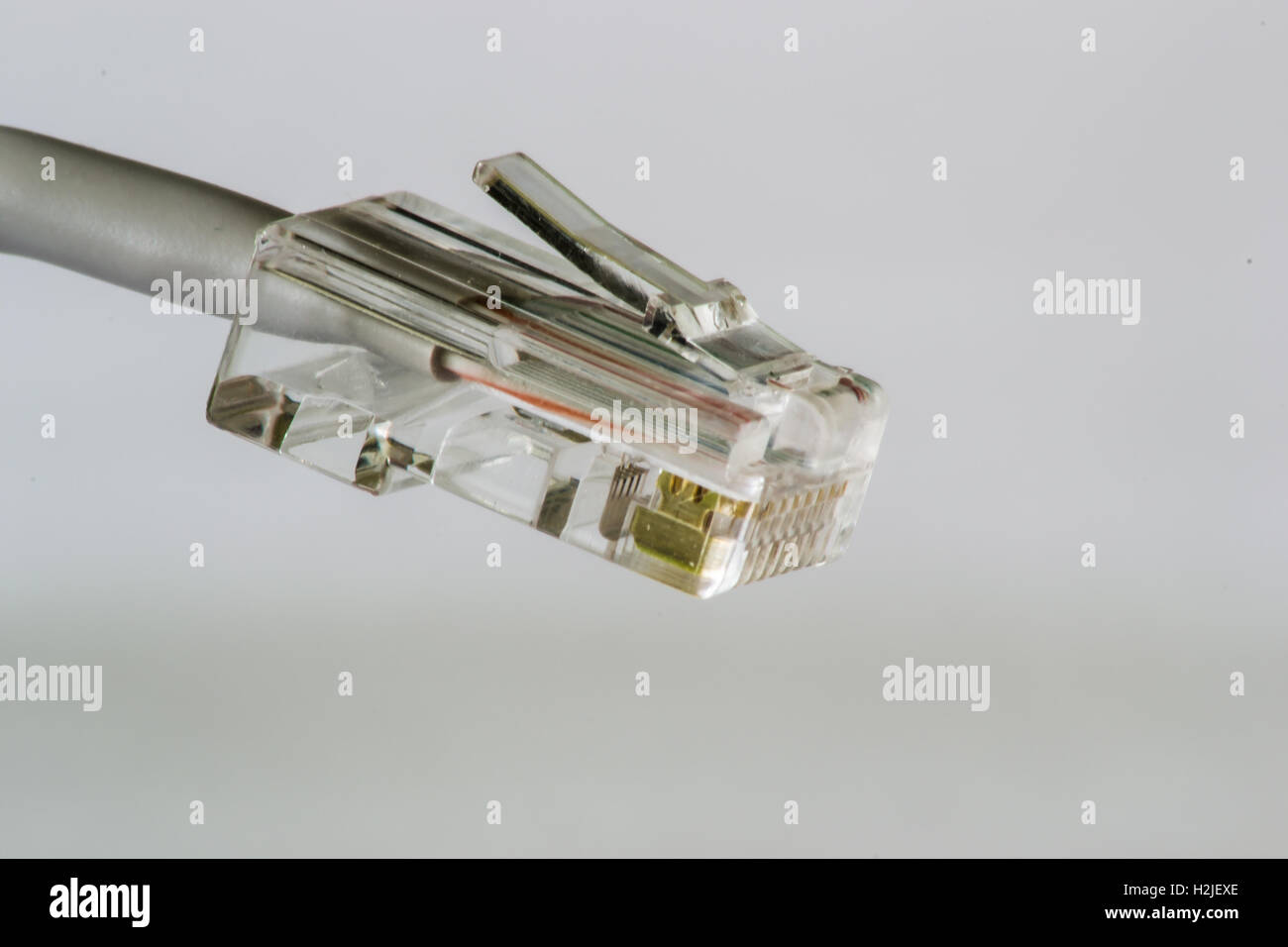 RJ-45 network plug on grey background Stock Photo - Alamy