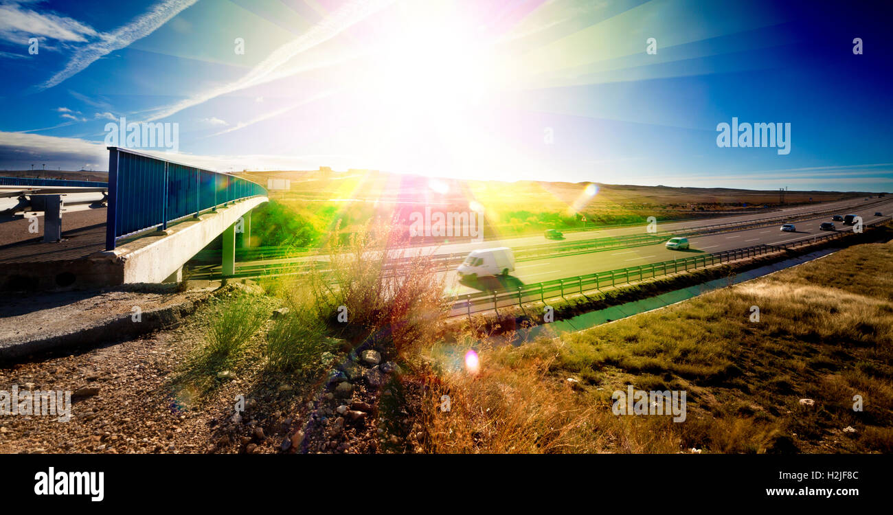 Highway traffic and sunset.Sunbeam and bridge over road Stock Photo - Alamy