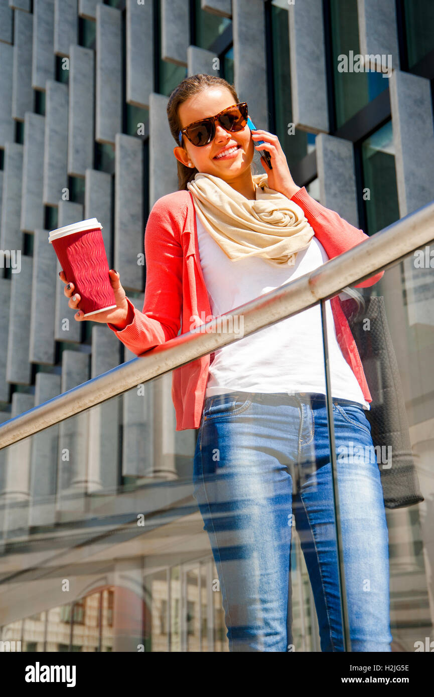 Pretty young woman using mobile phone Stock Photo - Alamy
