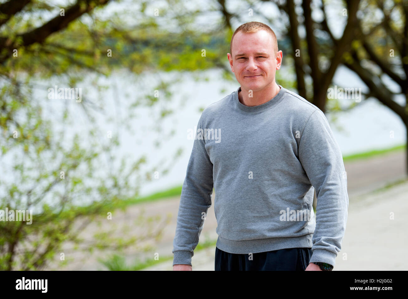 Active man with athletic body, exercise outdoore in park. Fit look ...