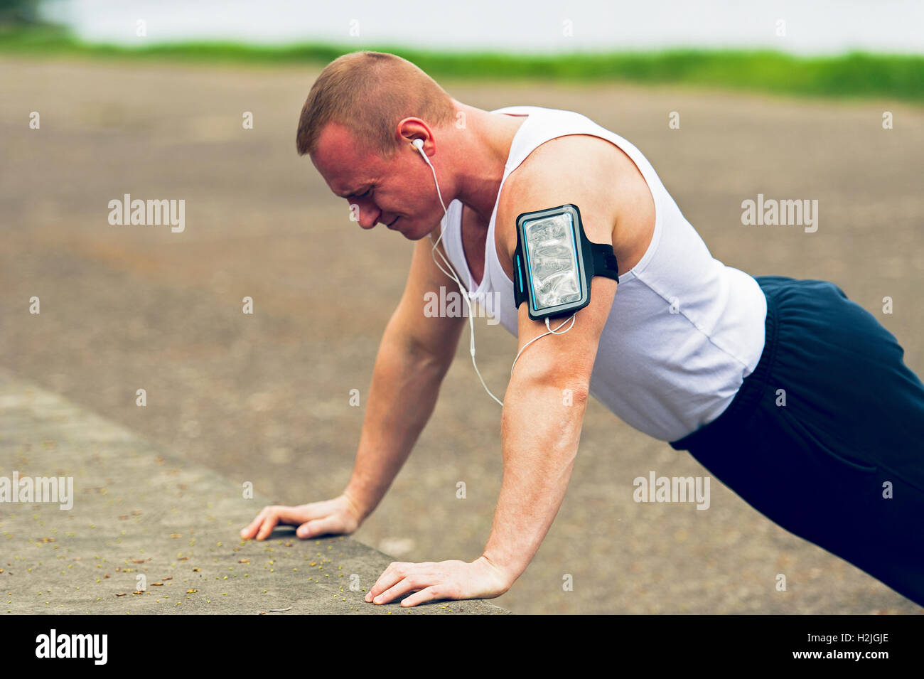 Active man doing pushups outdoor Stock Photo - Alamy