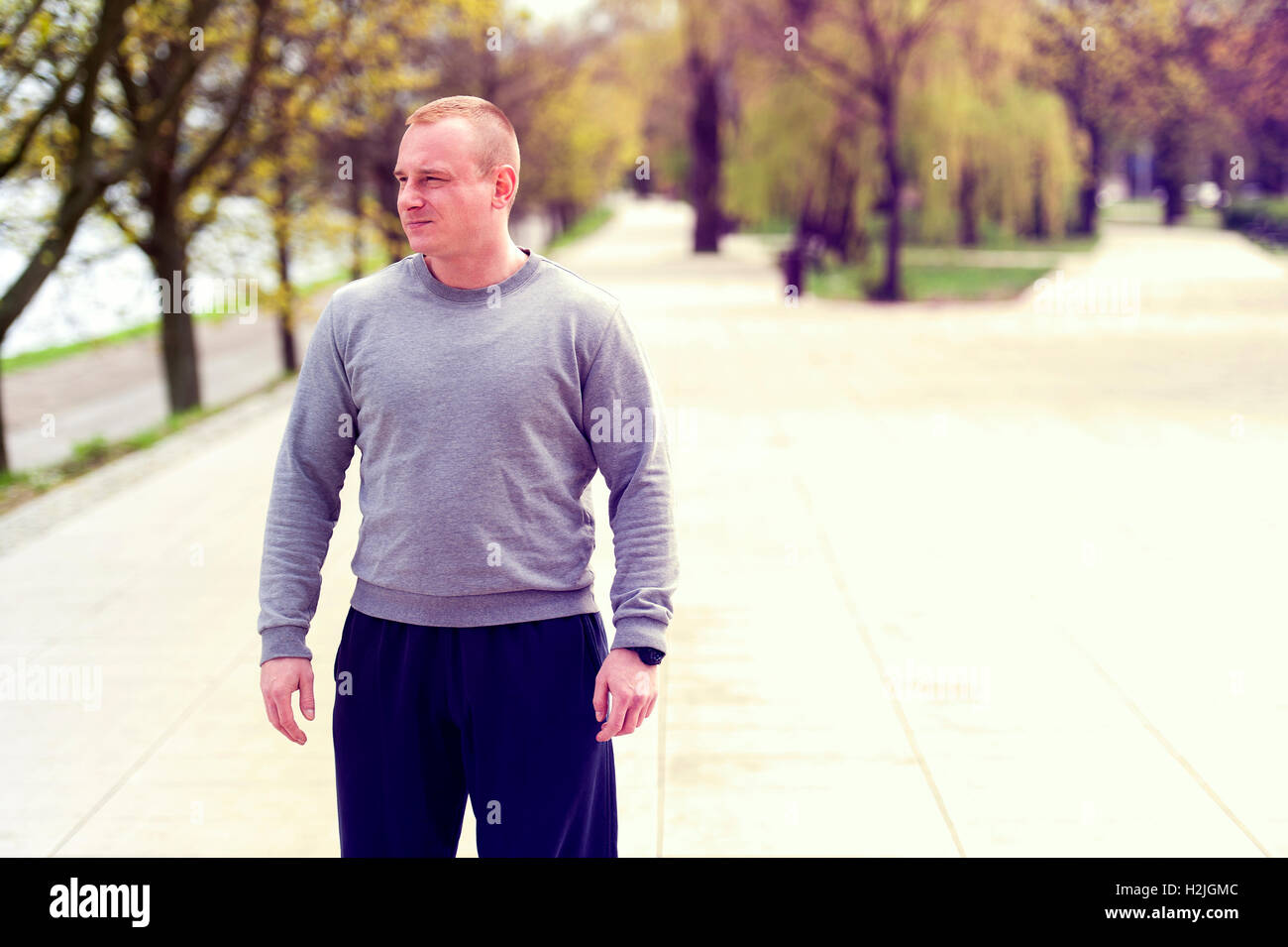 Active man with athletic body, exercise outdoore in park. Fit look ...