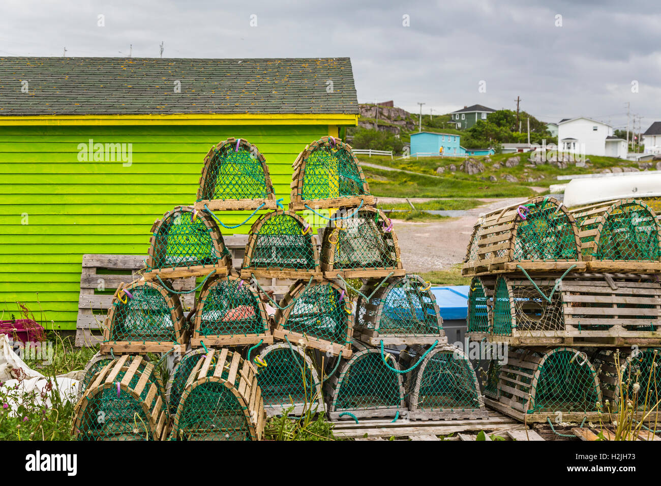 Fishing boats and colorful fishing stages in New Perlican, Newfoundland ...