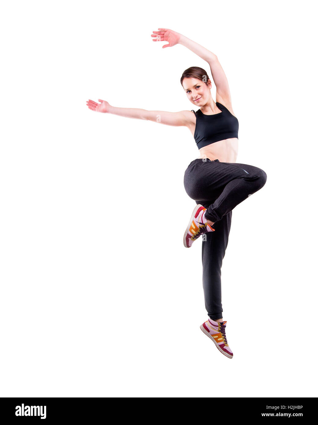 modern style dancer posing arms up on studio background Stock Photo - Alamy