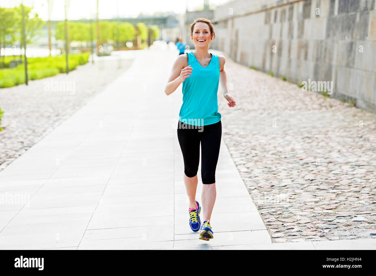 Fit woman jogging in park Stock Photo - Alamy