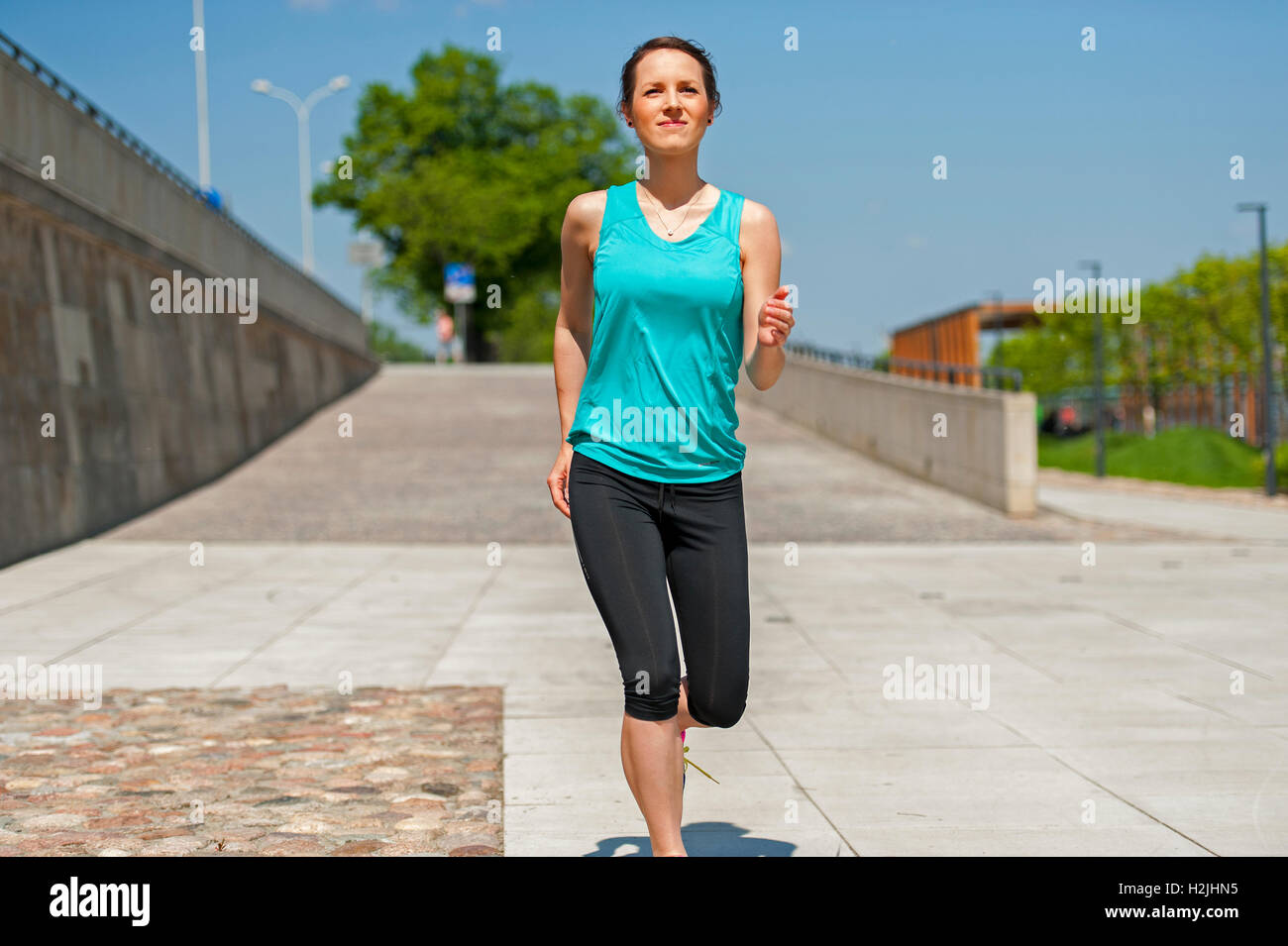 Fit woman jogging in park Stock Photo - Alamy