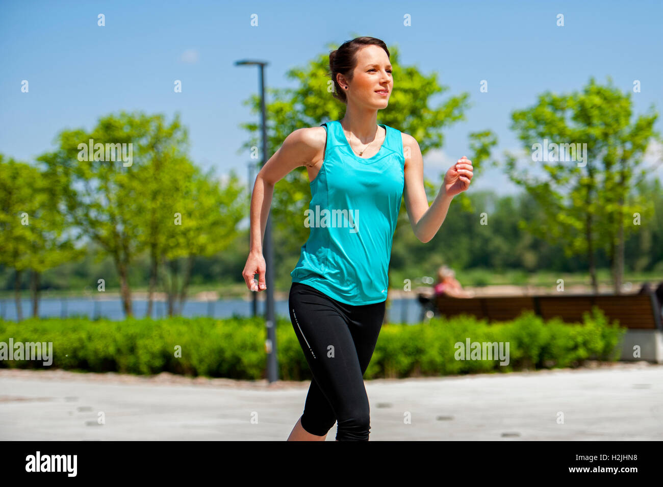 Fit woman jogging in park Stock Photo - Alamy