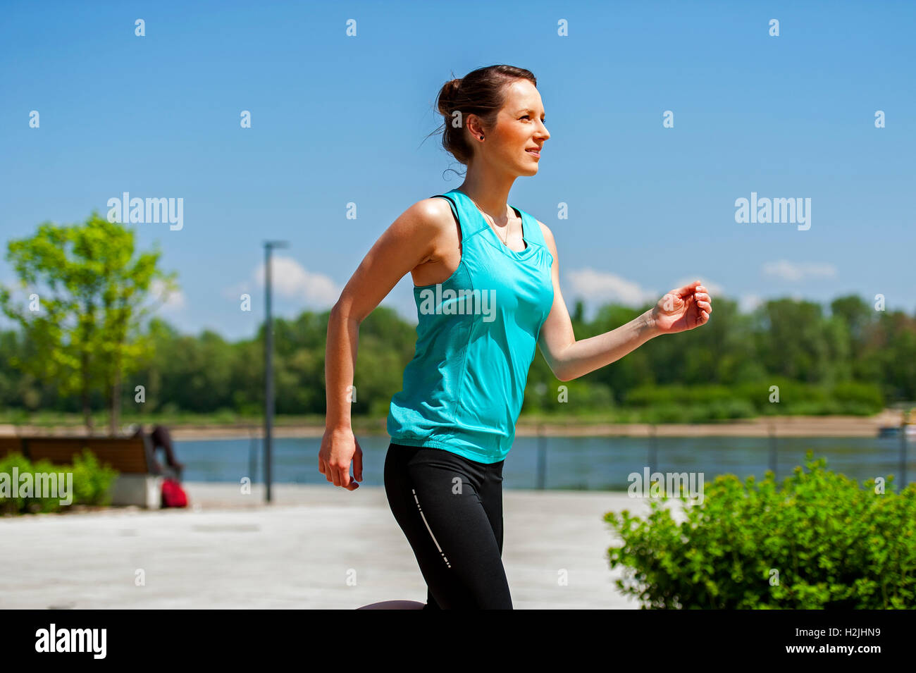Fit woman jogging in park Stock Photo - Alamy