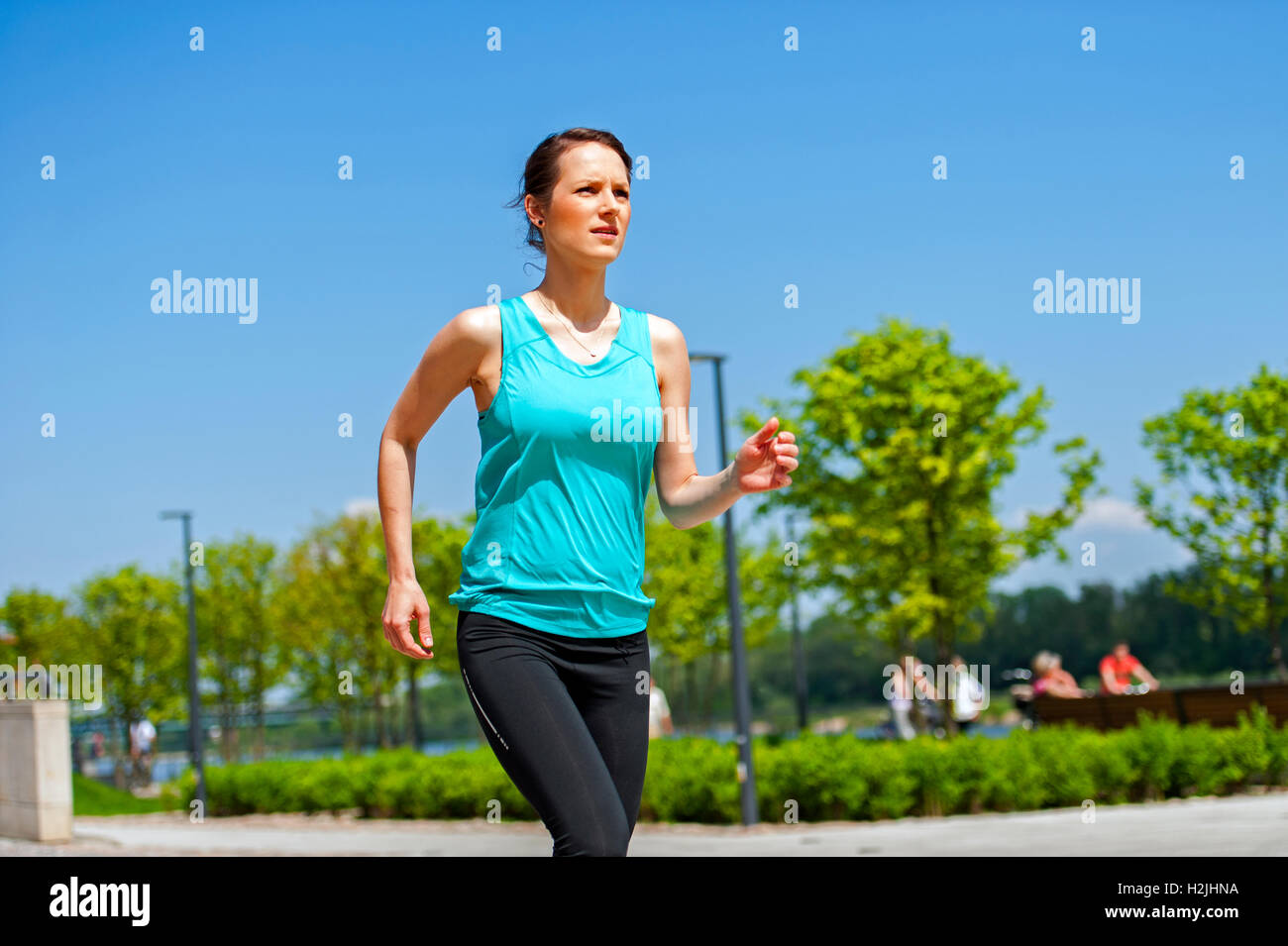 Fit woman jogging in park Stock Photo - Alamy
