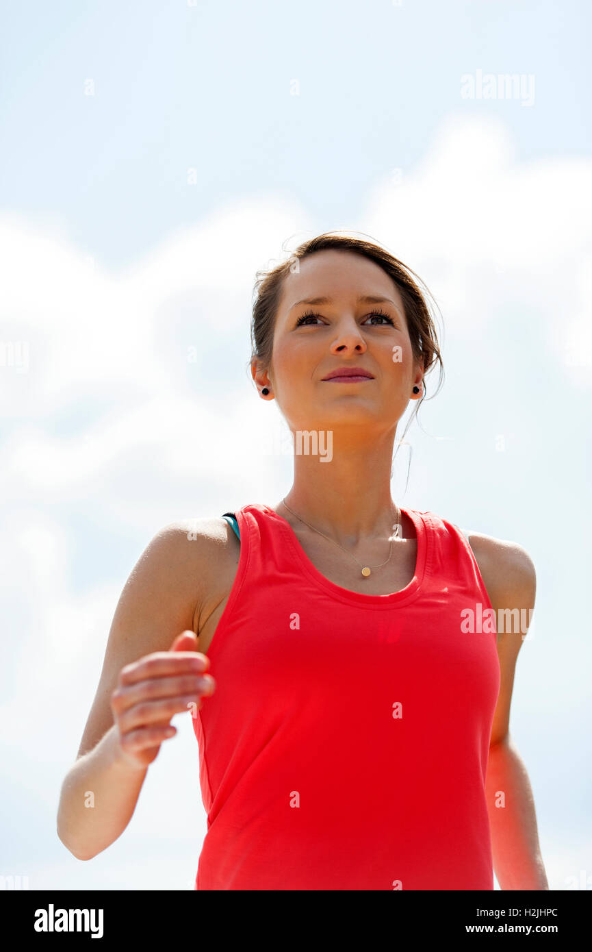 Fit woman jogging Stock Photo - Alamy