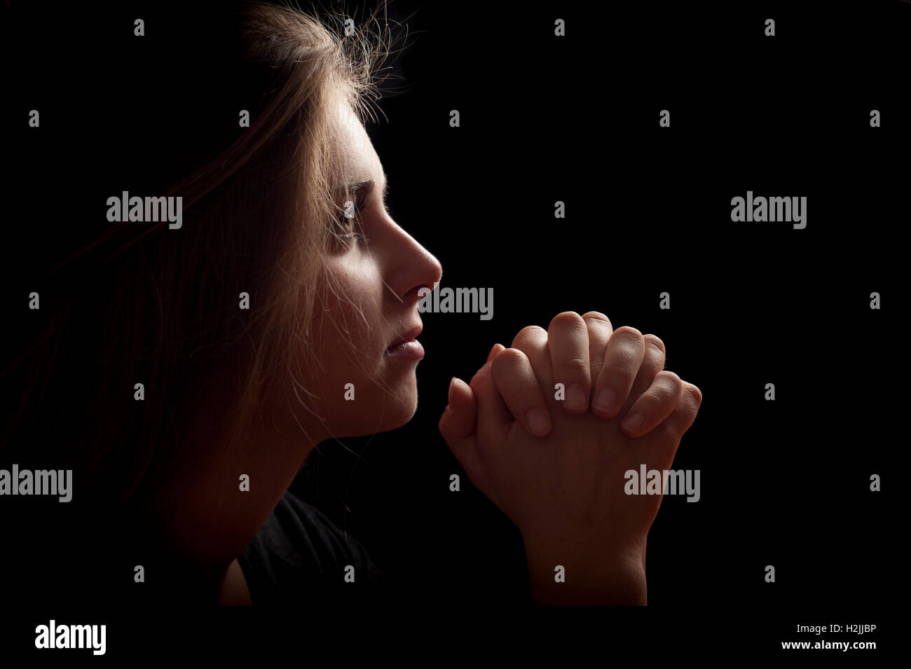 Religious christian girl praying hi-res stock photography and images ...