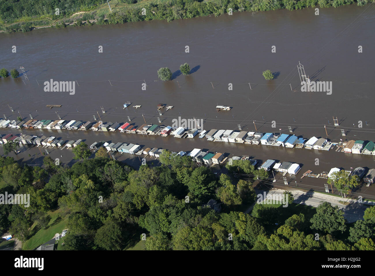 Aerial view of homes overwhelmed by flood waters from the Cedar River ...