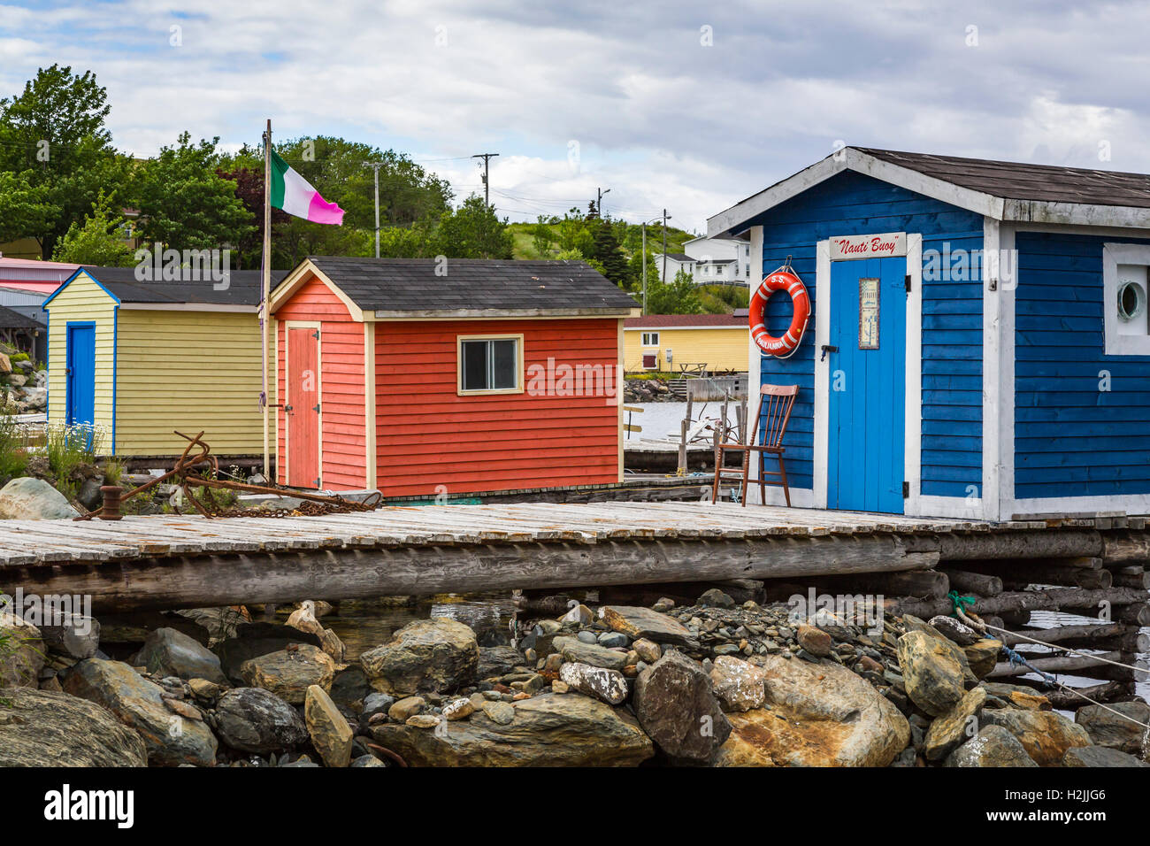 Fishing boats and colorful fishing stages in New Perlican, Newfoundland ...
