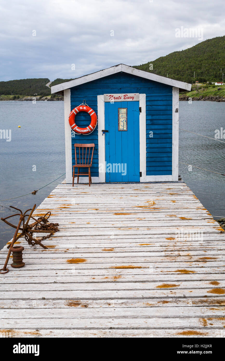 Fishing boats and colorful fishing stages in New Perlican, Newfoundland ...