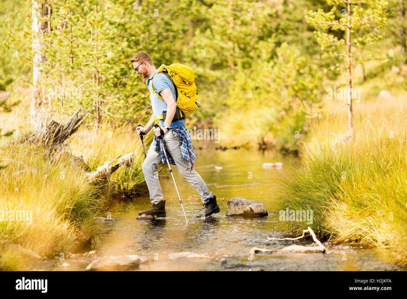 Young man crosses mountain hi-res stock photography and images - Alamy