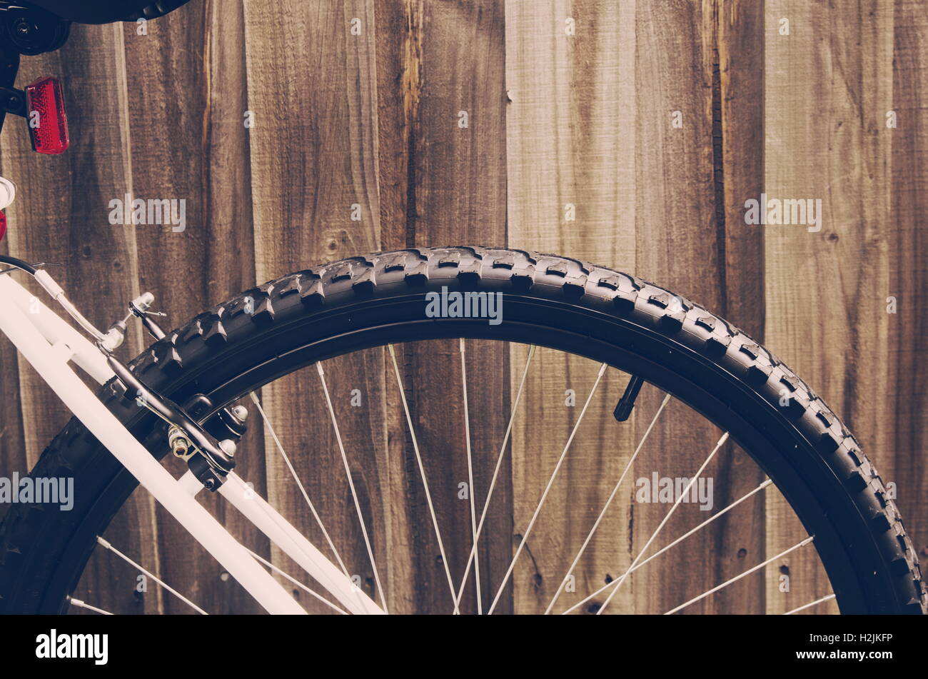 bicycle wheel outdoor near fence Stock Photo - Alamy