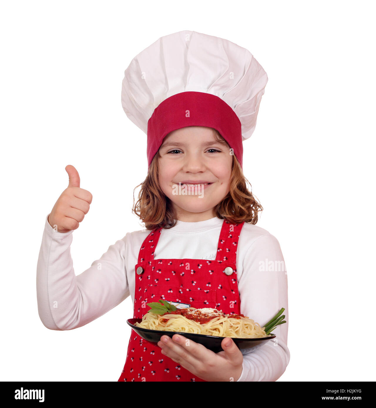 happy little girl cook with spaghetti and thumb up Stock Photo - Alamy