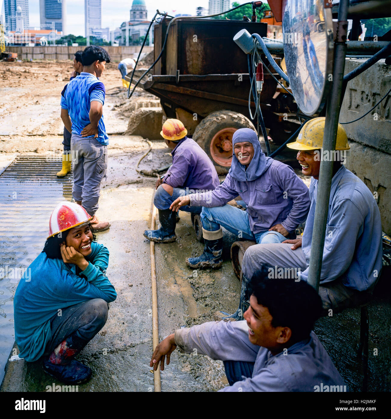 Construction workers having a break at building site, Singapore Stock ...