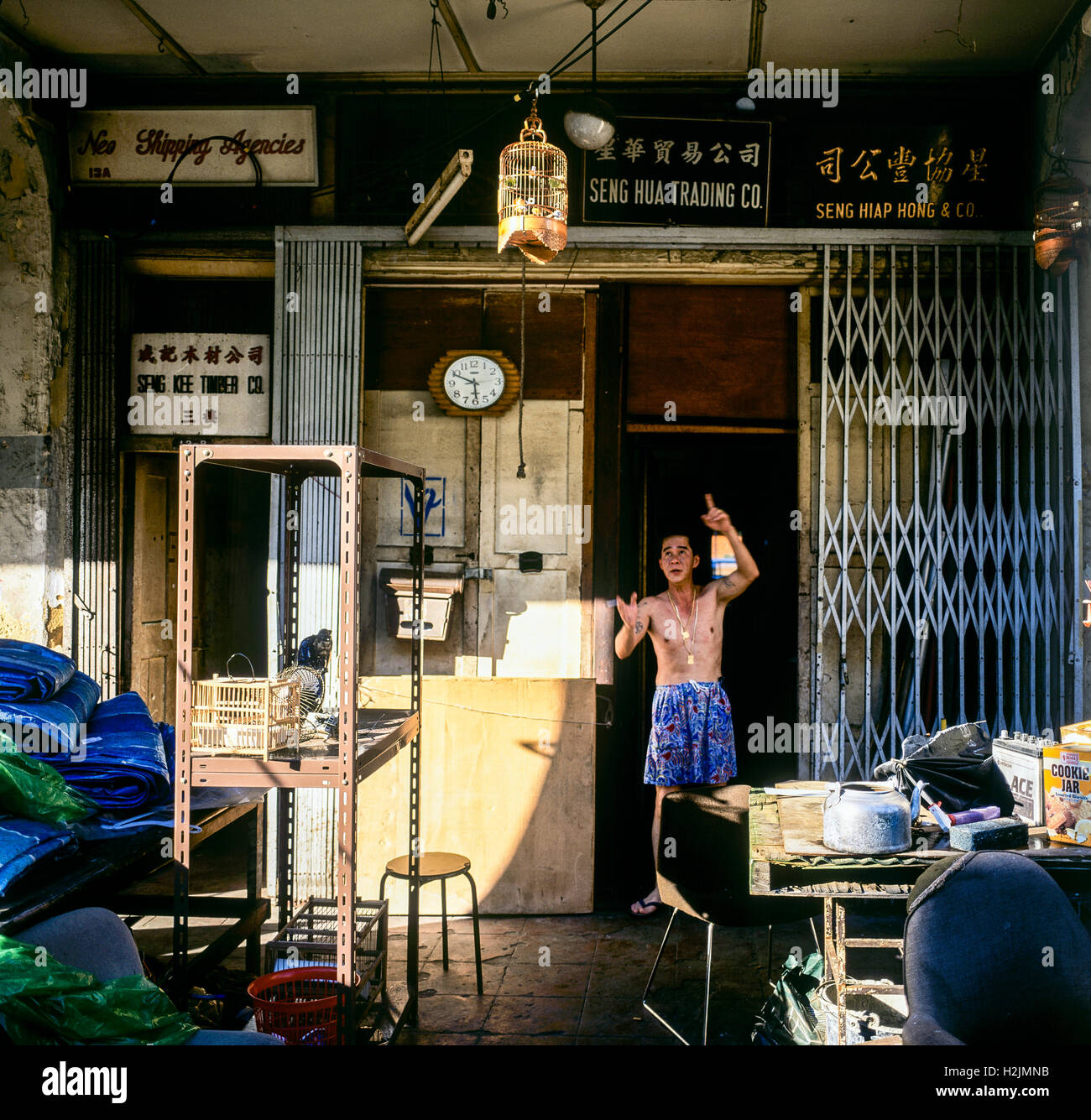 Man in front of his shophouse, Chinatown, Singapore Stock Photo - Alamy