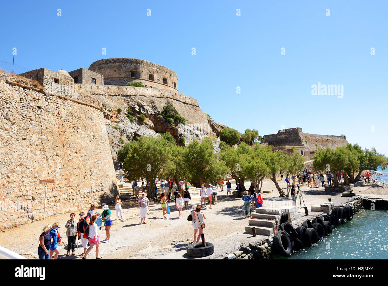 The tourists are on Spinalonga island, Spinalonga, Greece Stock Photo ...