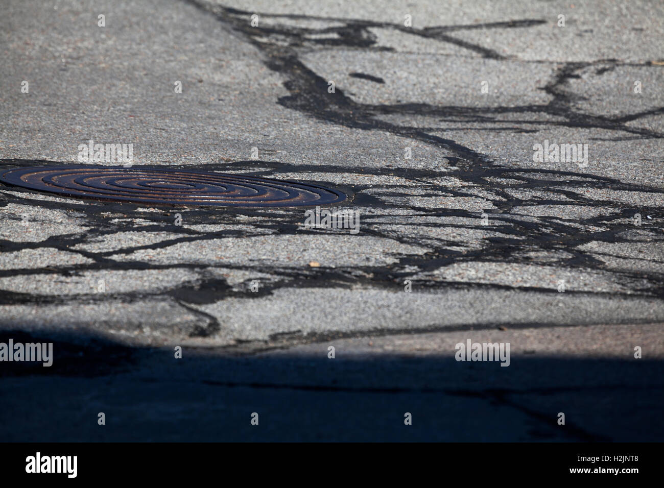 Asphalt manhole cover hi-res stock photography and images - Alamy