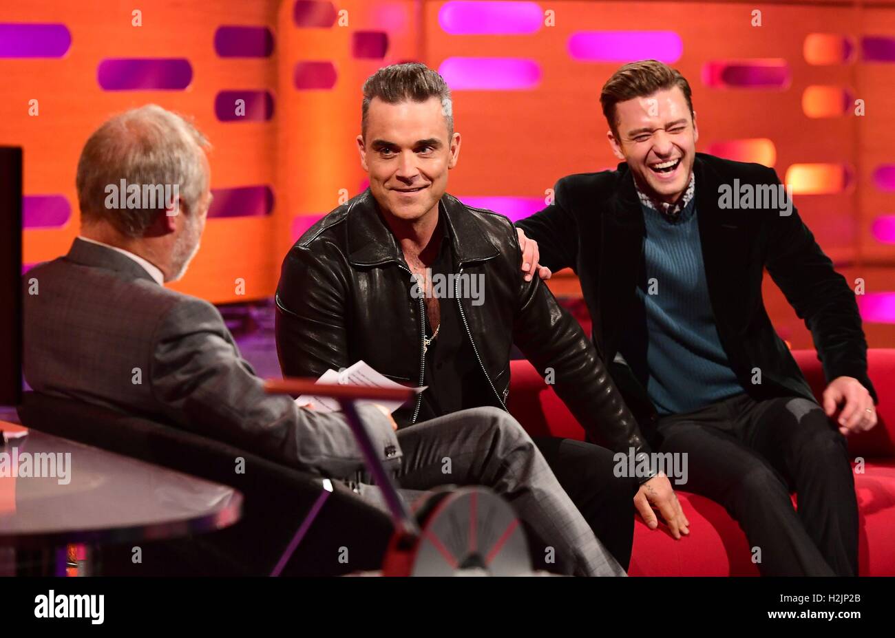 (left to right) Host Graham Norton, Robbie Williams and Justin ...