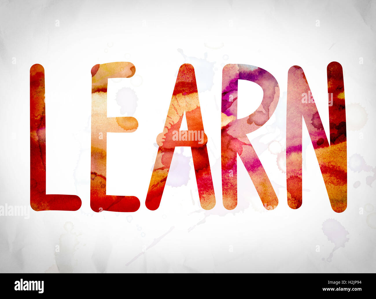 The word "Learn" written in watercolor washes over a white paper ...