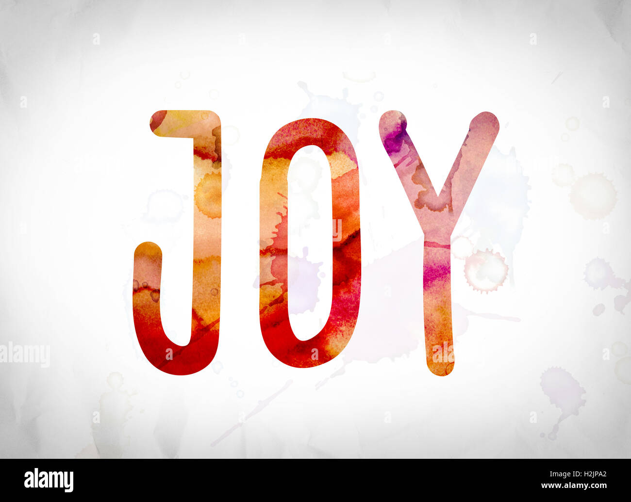 The word "Joy" written in watercolor washes over a white paper ...