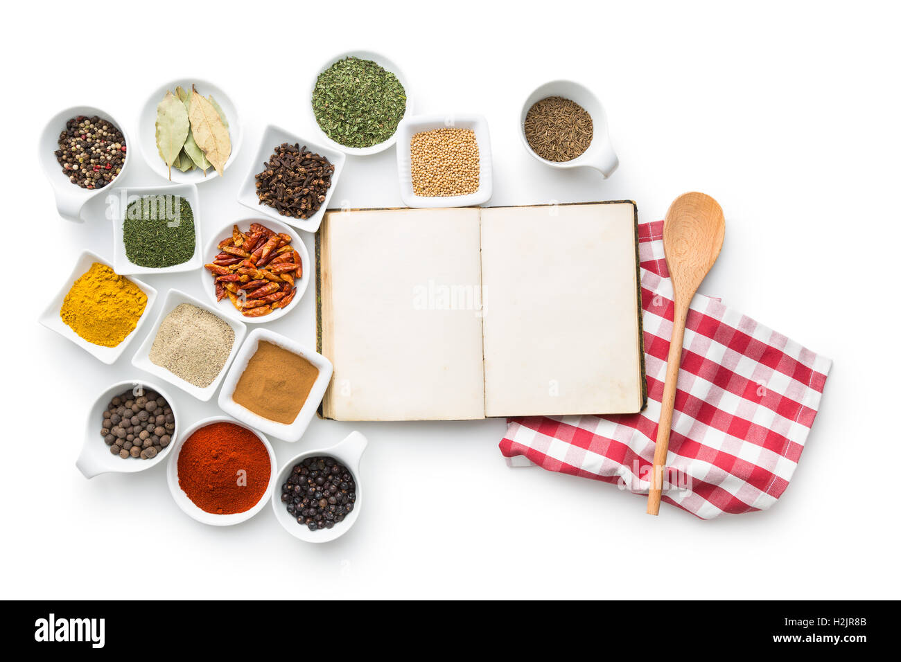 Blank cookbook and various spices isolated on white background. Top ...