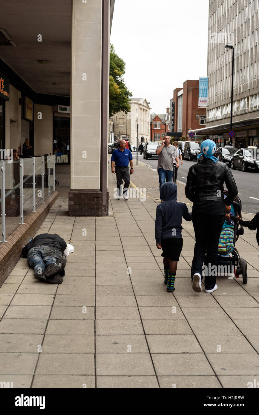 Sleeping homeless man sleeps outside Chelmsford County Council Library ...
