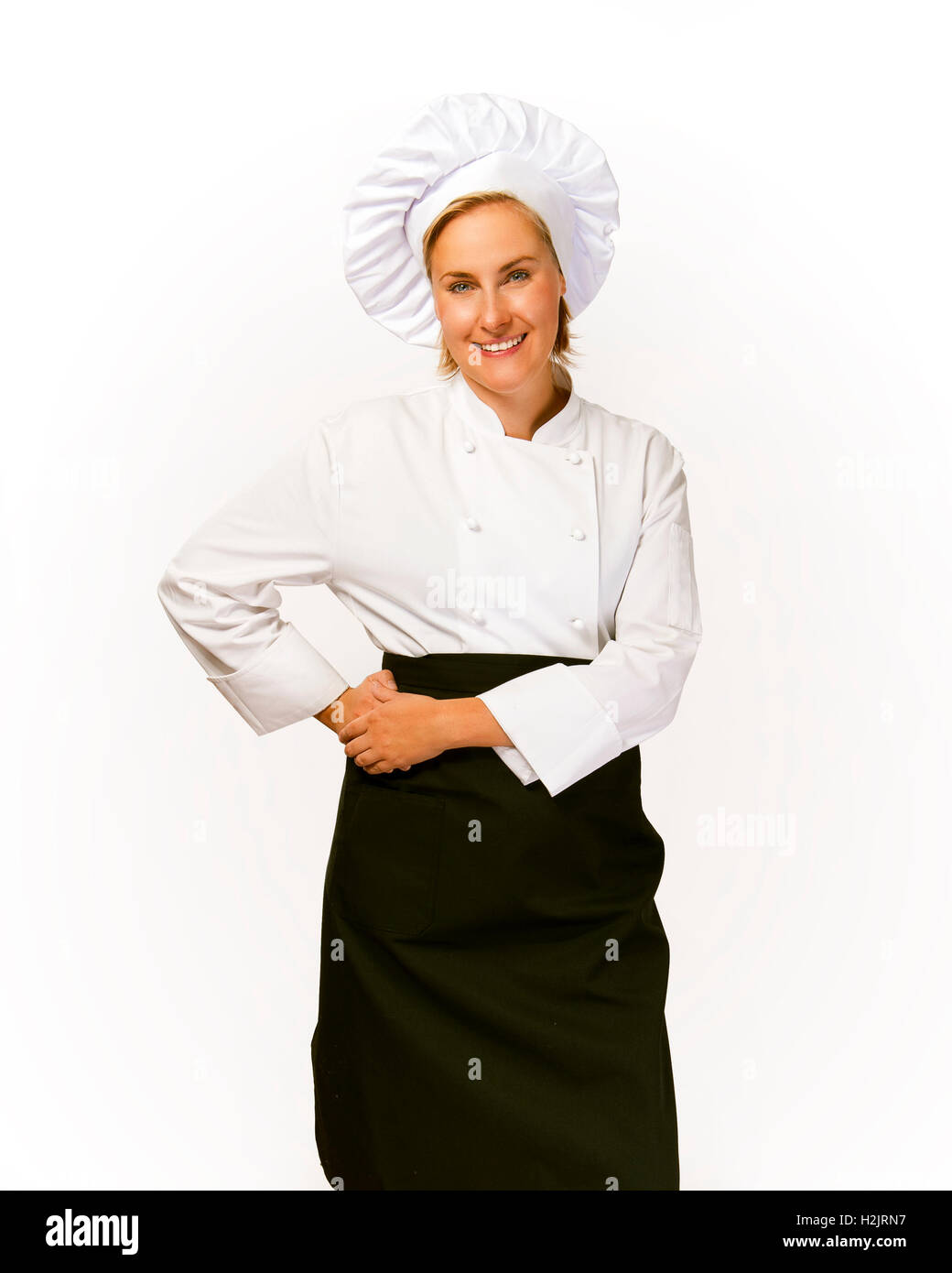 Woman chef smiling over white bacground Stock Photo - Alamy