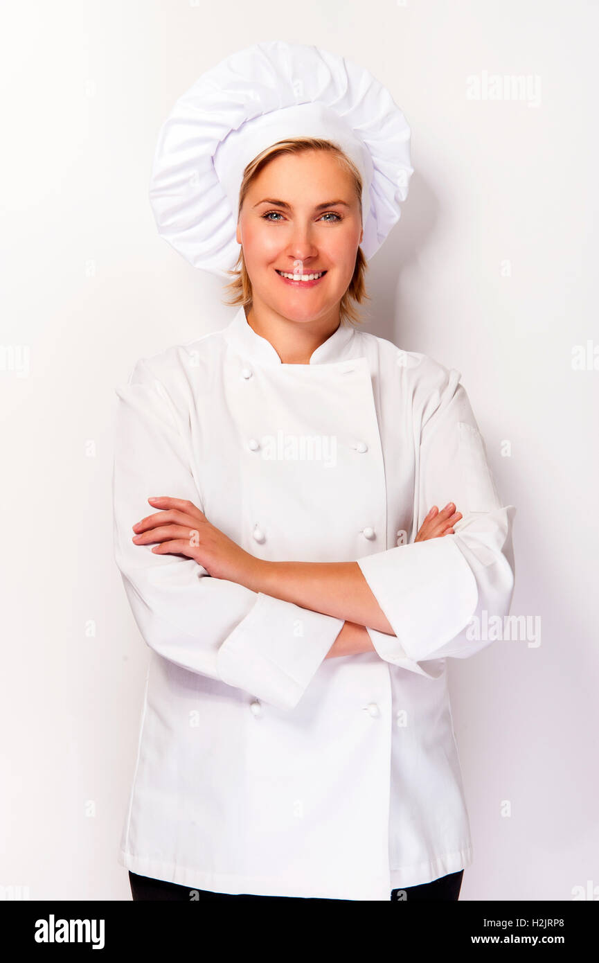 Woman chef in cook outfit over white background smiling with crossed ...