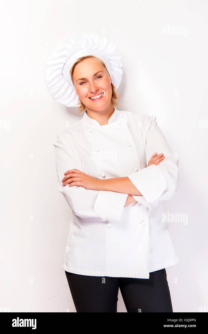Woman chef in cook outfit over white background smiling with crossed ...