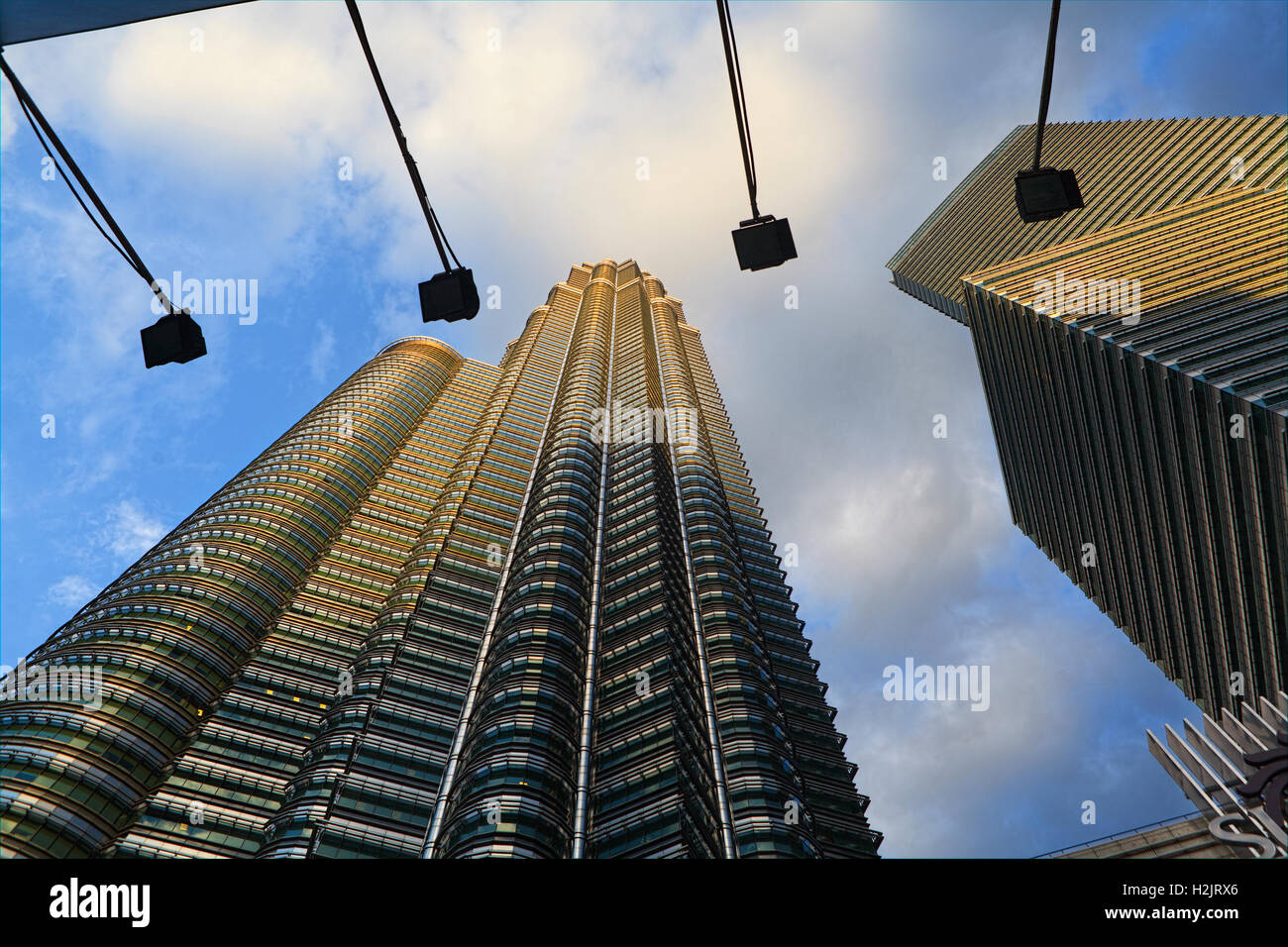 Petronas Twin Tower #2 shines a golden color at sunset in Kuala Lumpur ...