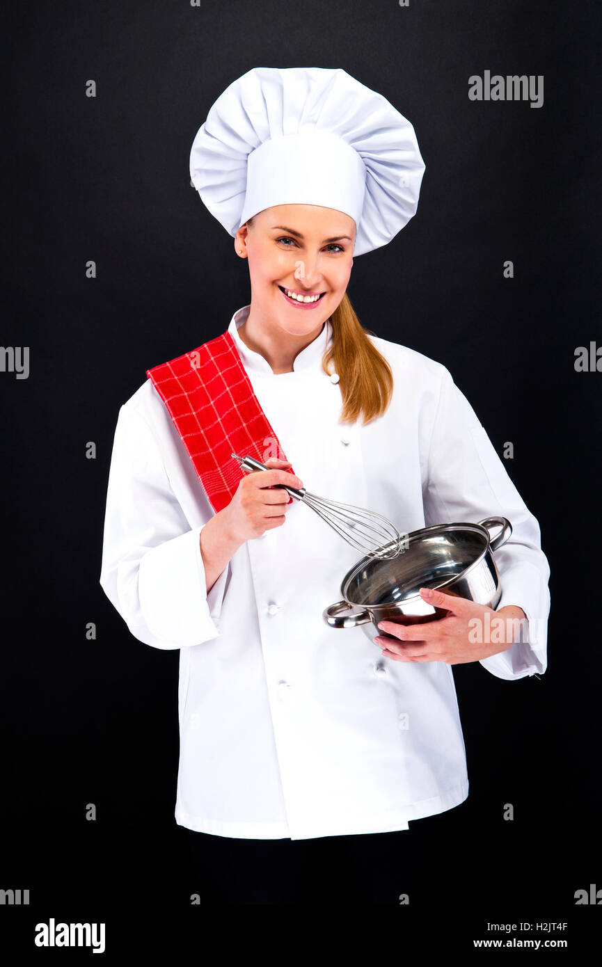 cooking and food concept - smiling female chef with pot and other tools ...