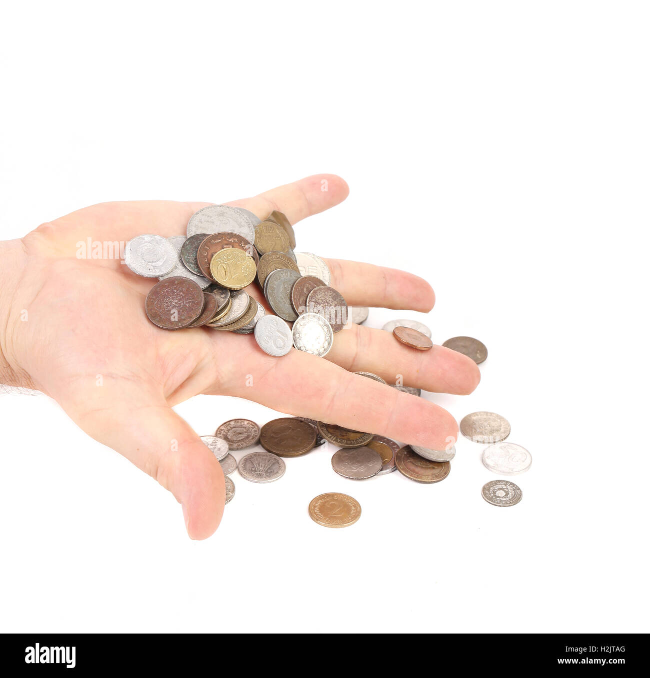 Coins spilled from hand Stock Photo - Alamy