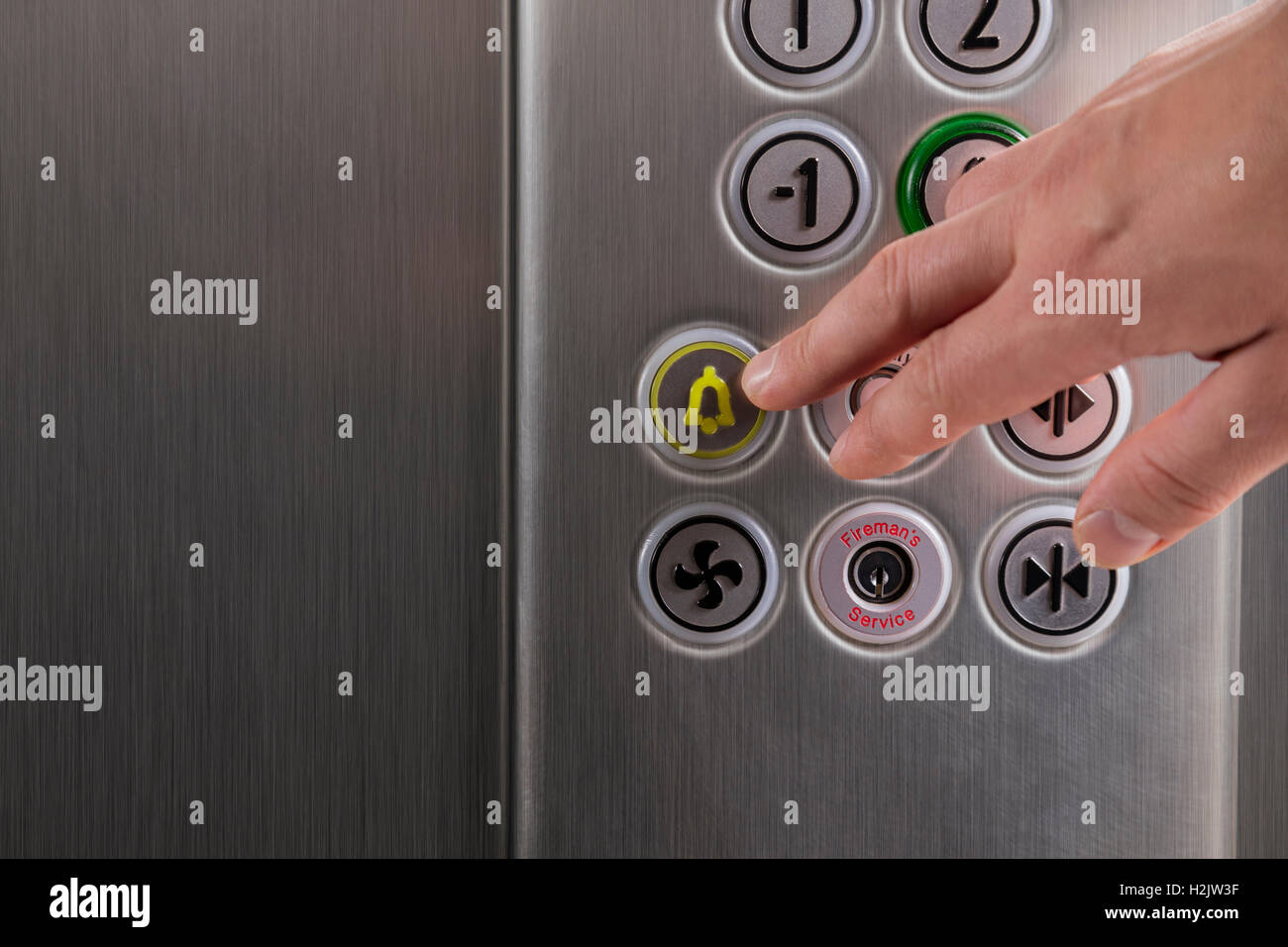 Man pressing the alarm button in the elevator with his finger Stock ...